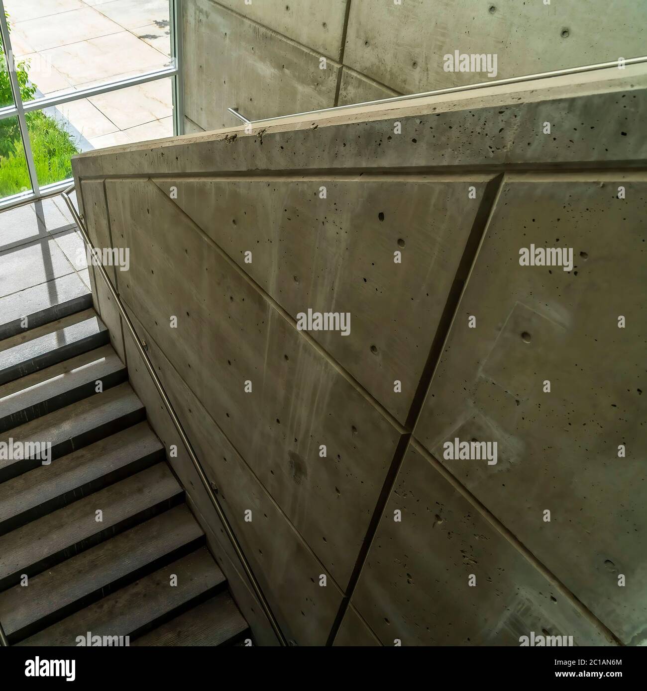 Square Commercial building interior with staircase and handrails ...