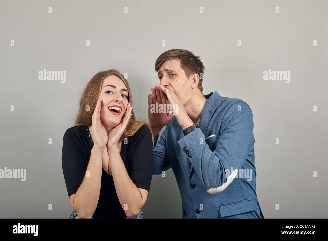 Scream and shout holding hands near opened mouth. Screaming loudly with ...