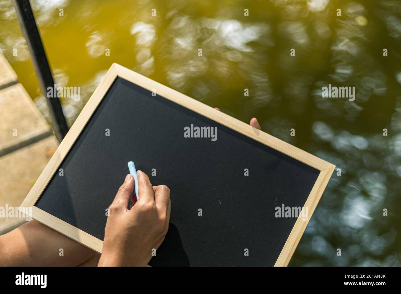 Hands use chalk for drawing, writing balckboard in the parks. Education ...