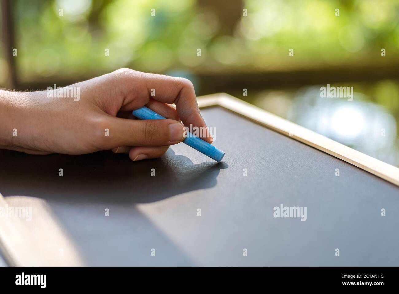 Hands use chalk for drawing, writing balckboard in the parks. Education ...