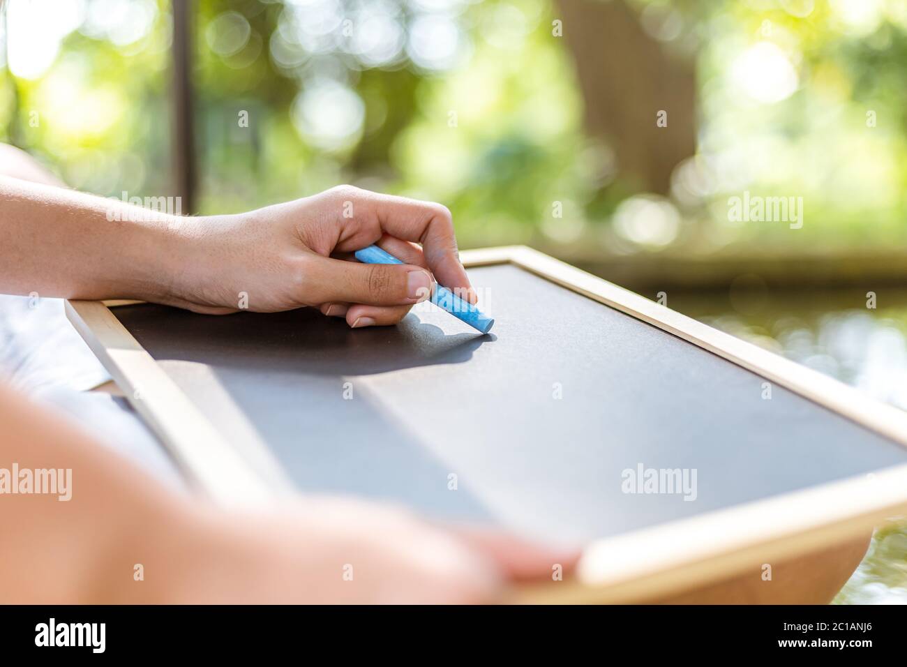 Hands use chalk for drawing, writing balckboard in the parks. Education ...
