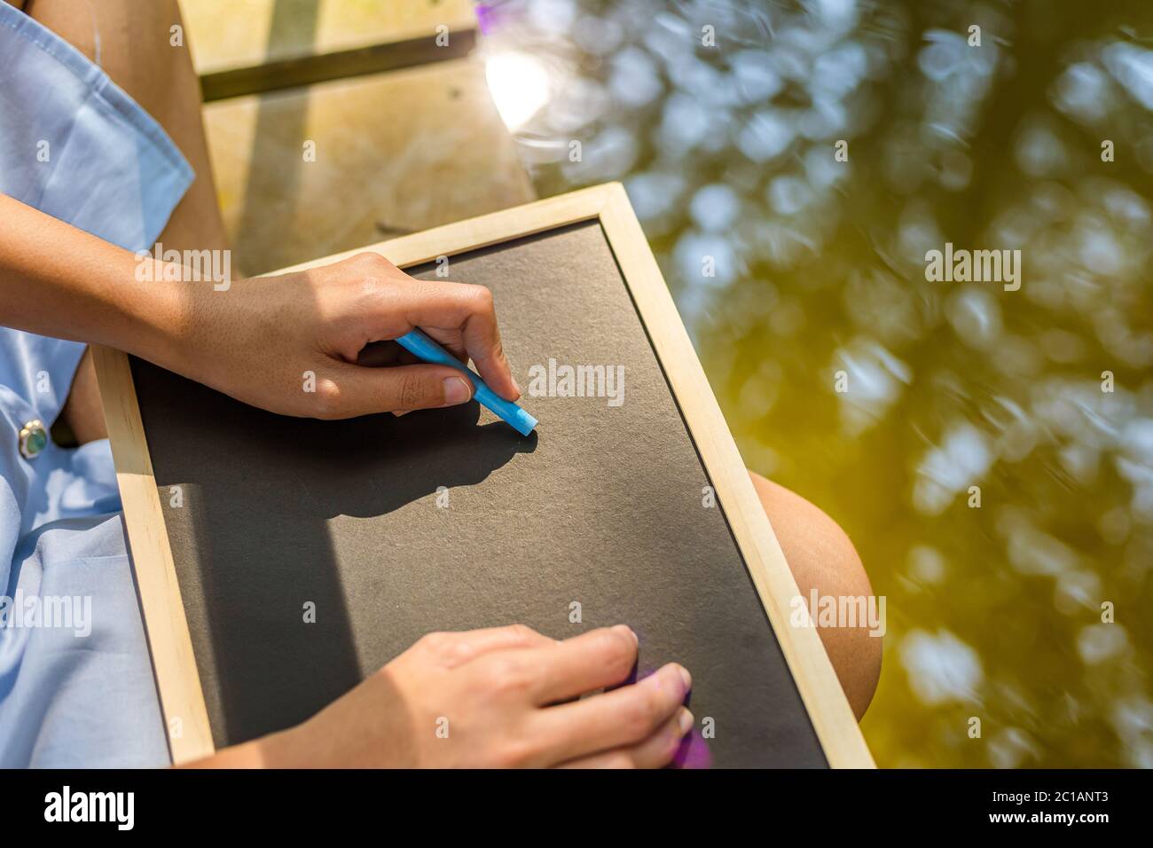 Hands use chalk for drawing, writing balckboard in the parks. Education ...