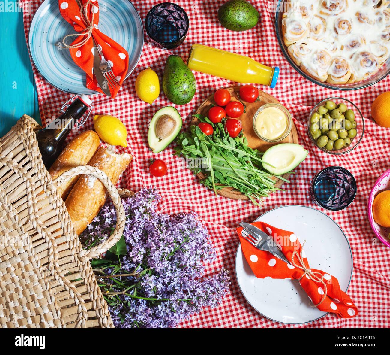 Homemade picnic with fresh fruits, vegetables, salad, orange juice ...