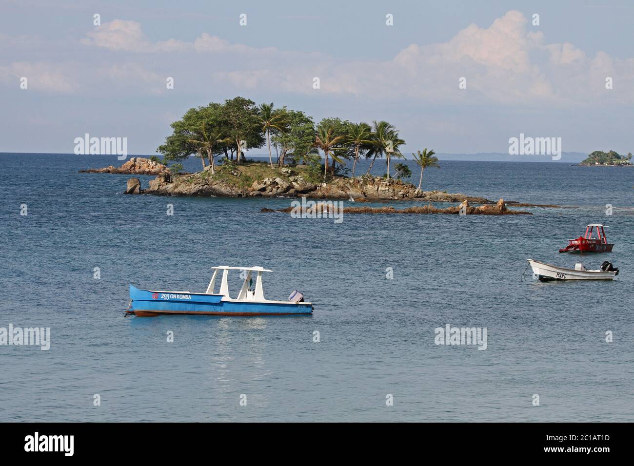 View of boats and small islet from beach, Ampangorinana Village, Nosy ...