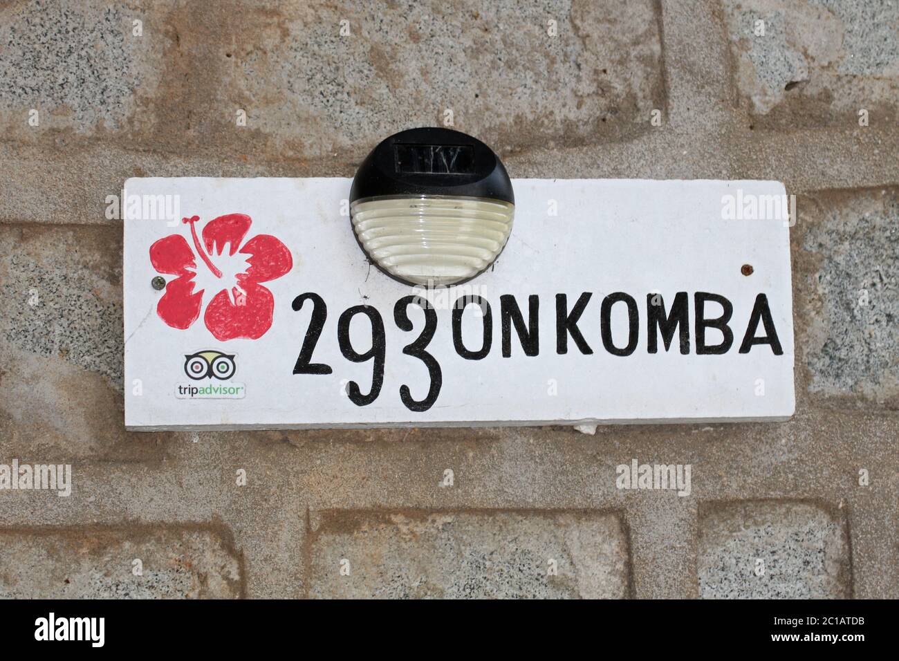 Hotel sign and light at 293 on Komba Guest House, Ampangorinana Village ...