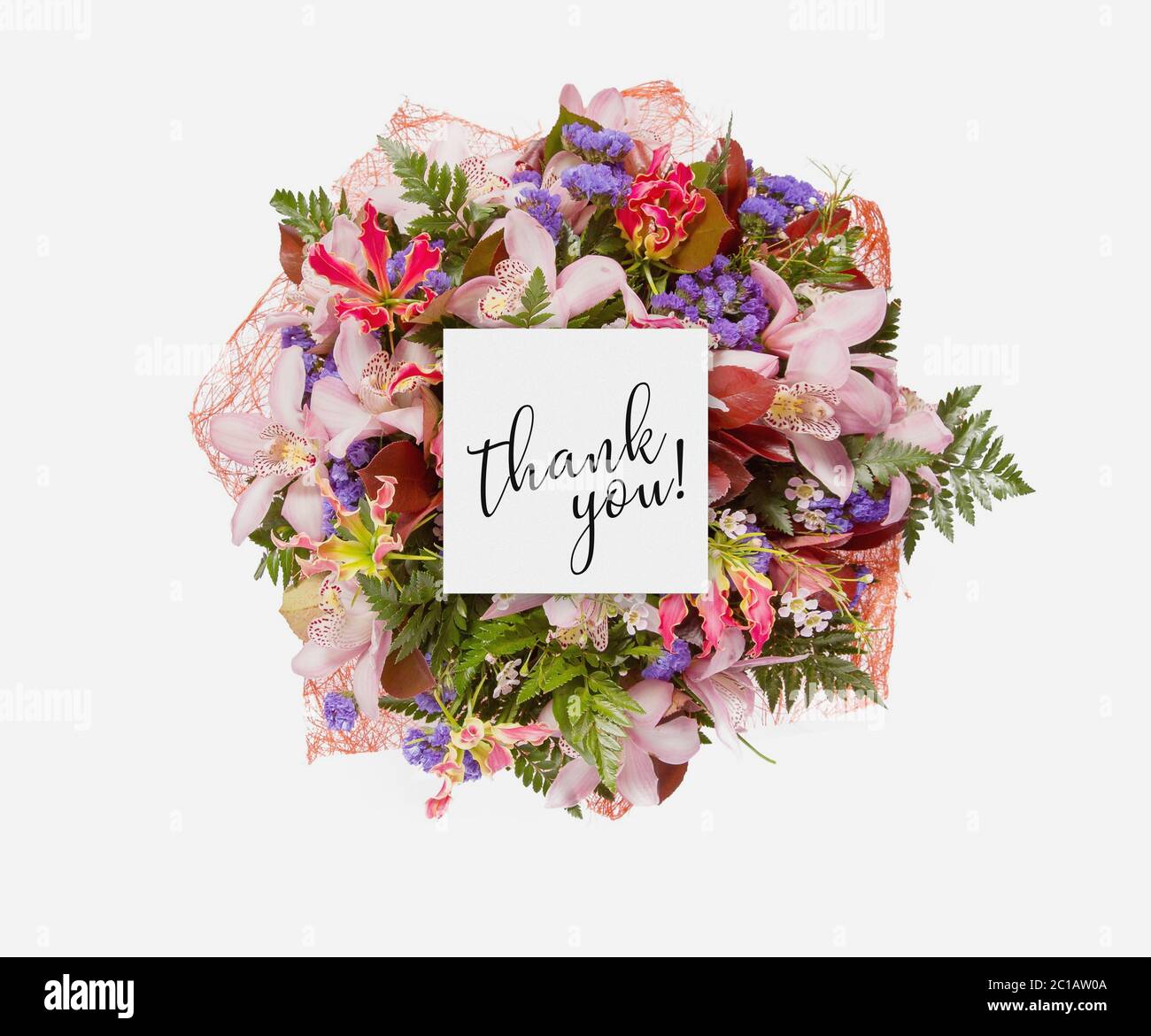 Fresh flowers bunch and card with words thank you written on it Stock ...