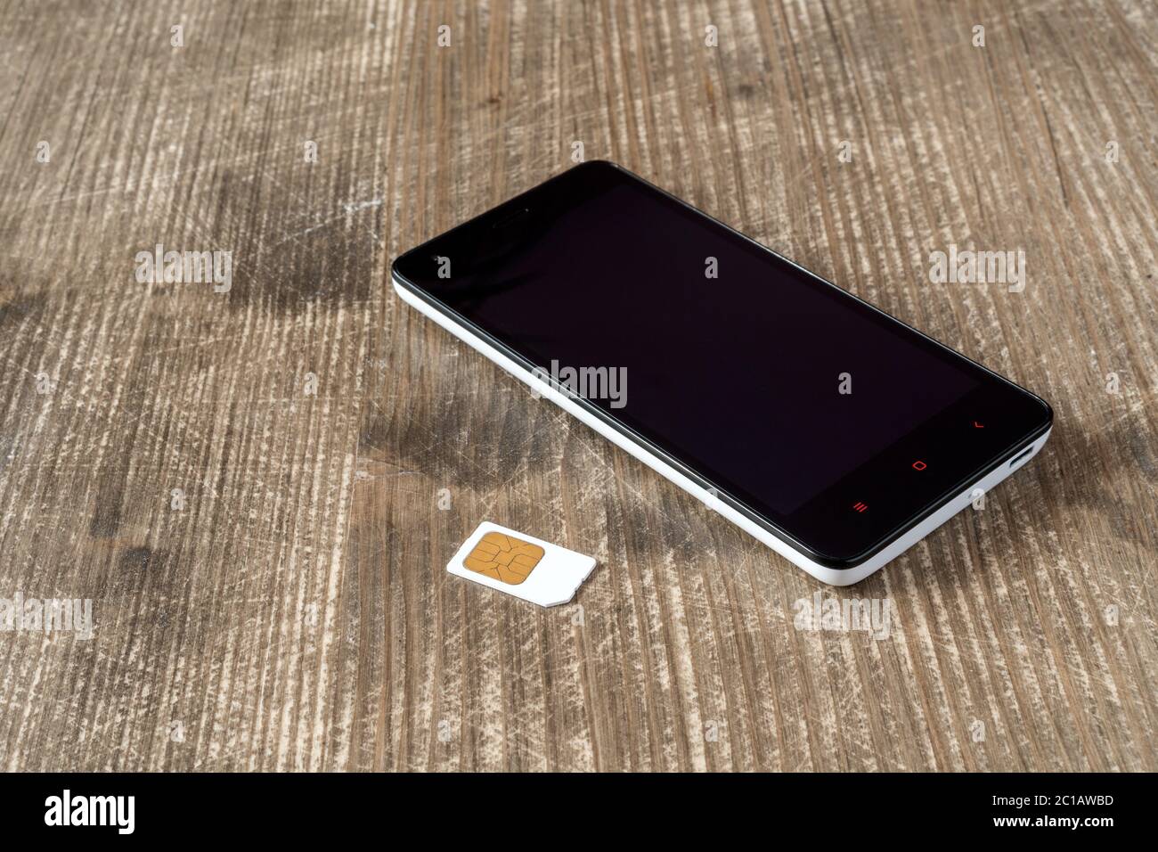 Smartphone and SIM card Stock Photo - Alamy