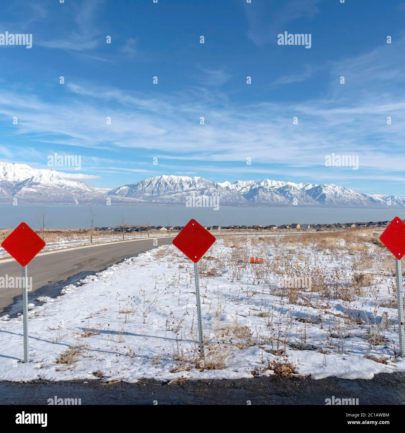 Square Diamond shaped traffic signs on road with Wasatch Mountains and ...