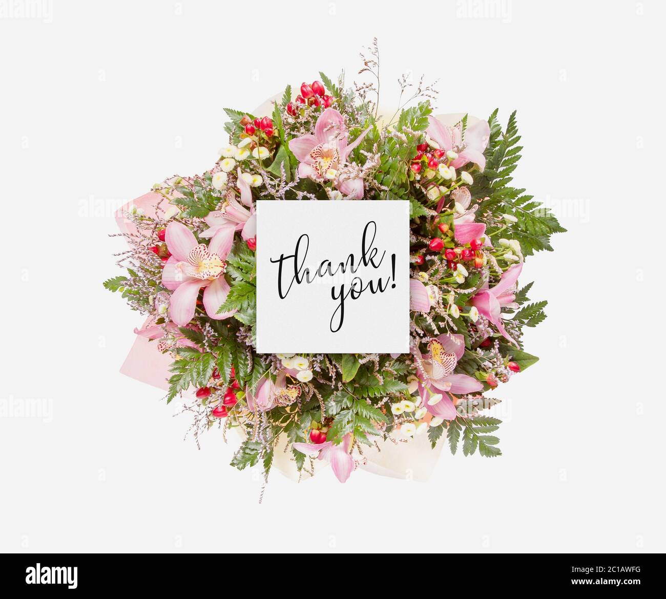 Fresh flowers bunch and card with words thank you written on it Stock ...