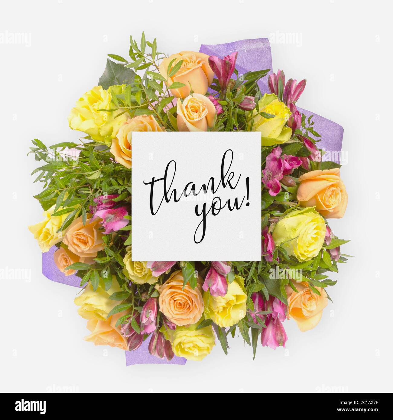 Fresh flowers bunch and card with words thank you written on it Stock ...