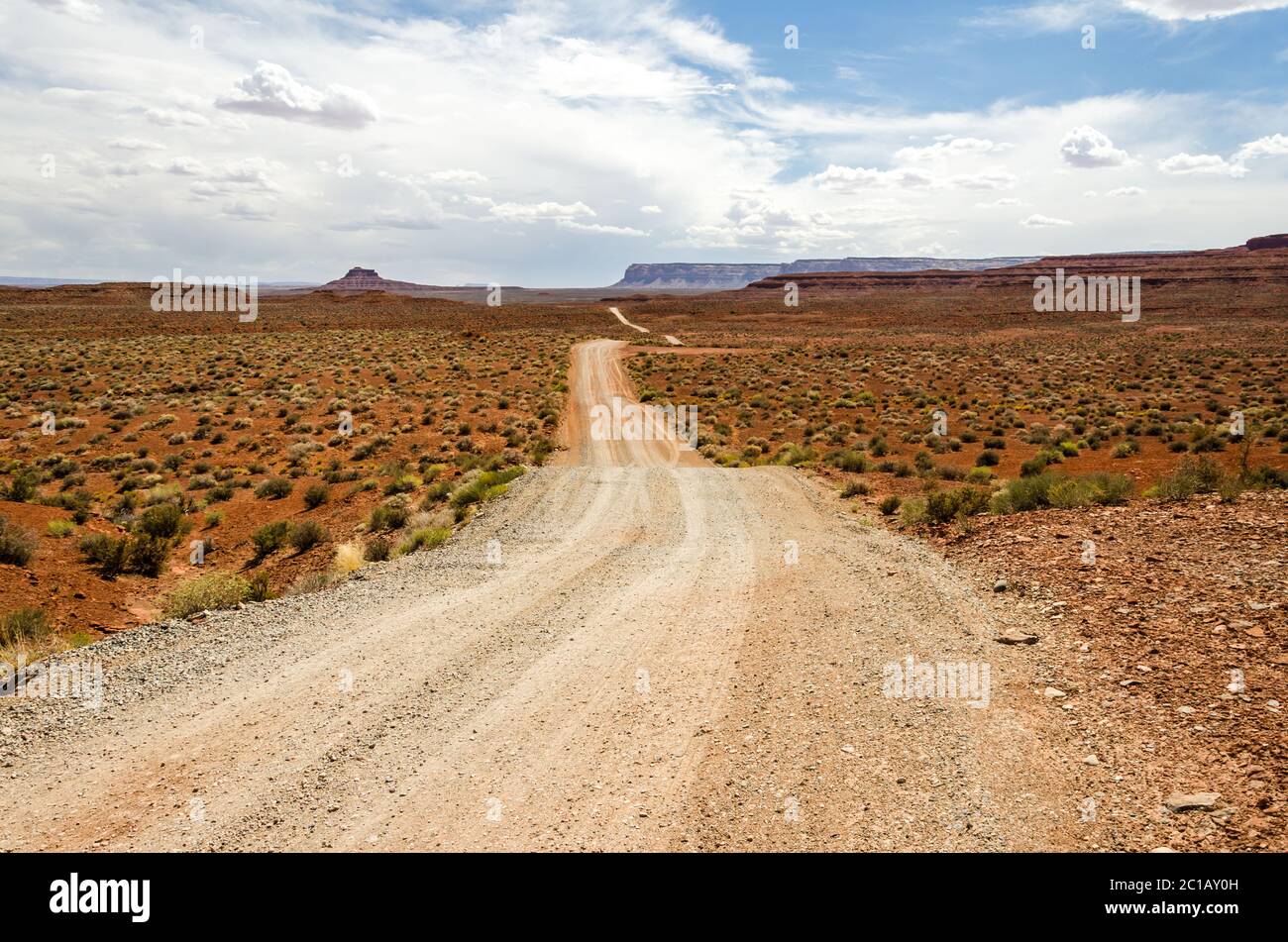 Dirt road in red desert landscape Stock Photo - Alamy