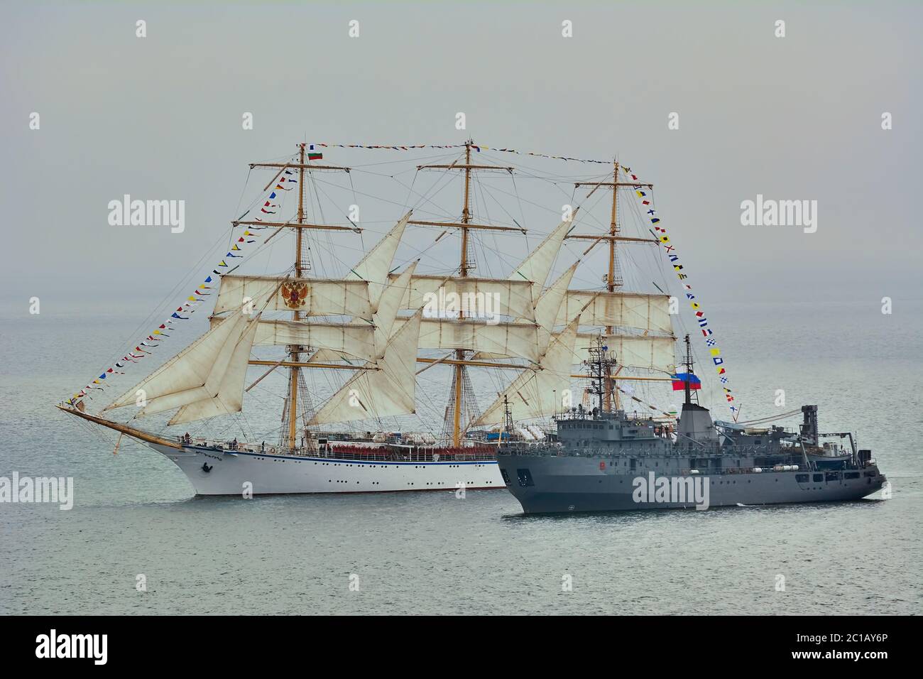 Degaussing ship next to the Sailing one Stock Photo - Alamy