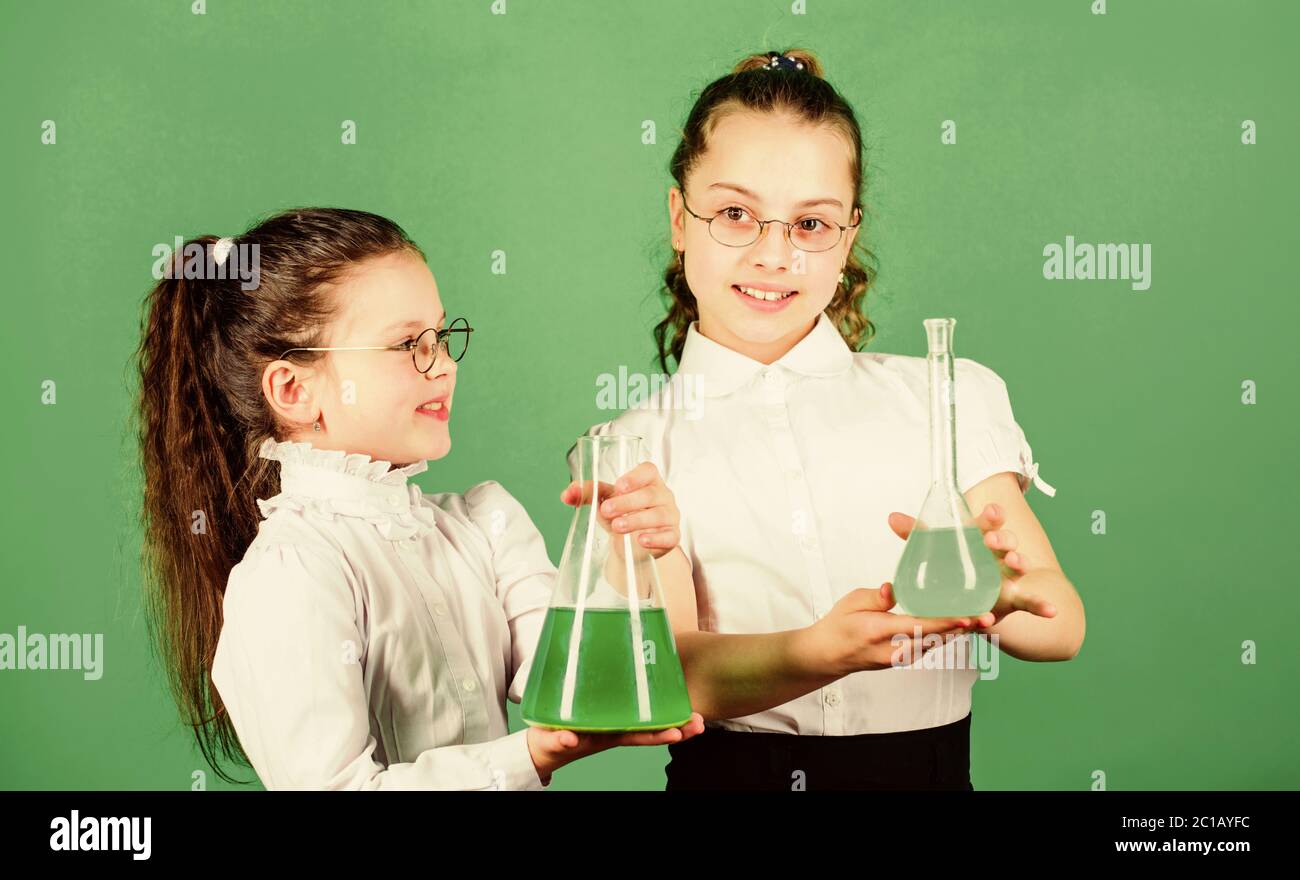 children study chemistry lab. little smart girls with testing flask ...