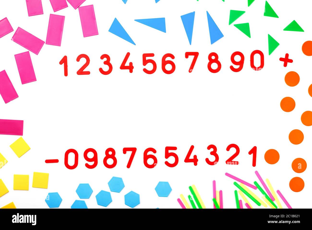 Multicolored plastic figures and numbers on a white background ...