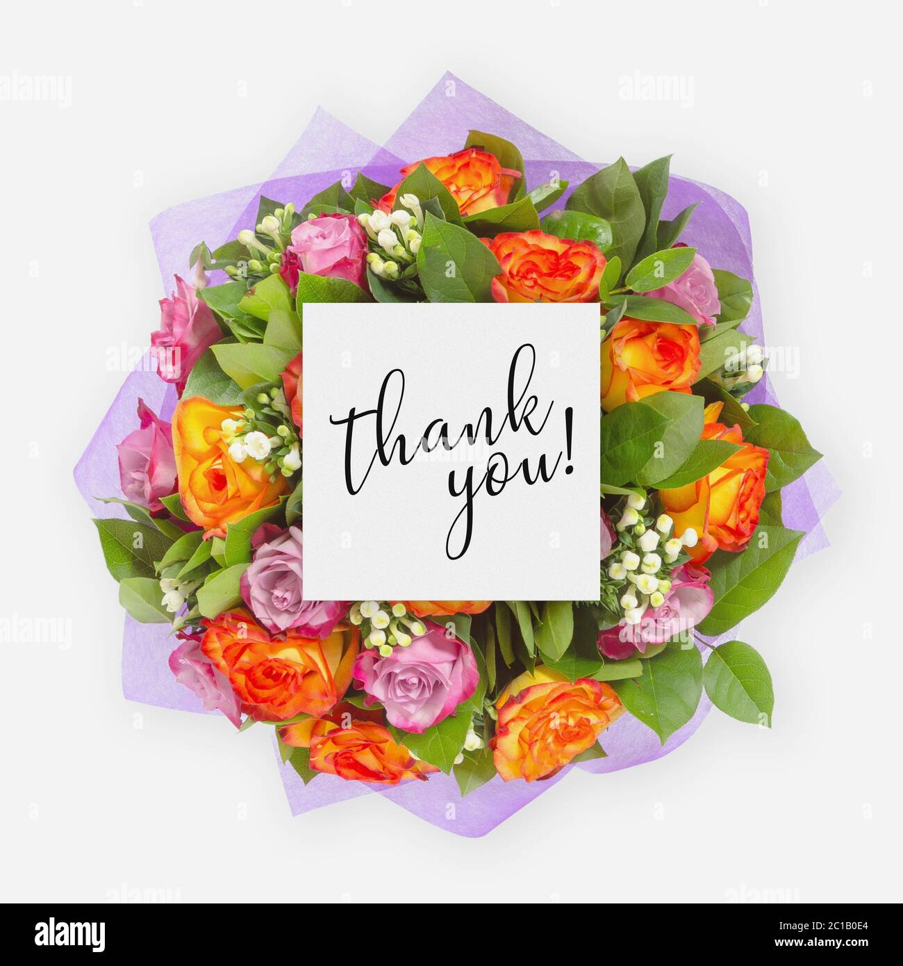 Fresh flowers bunch and card with words thank you written on it Stock ...