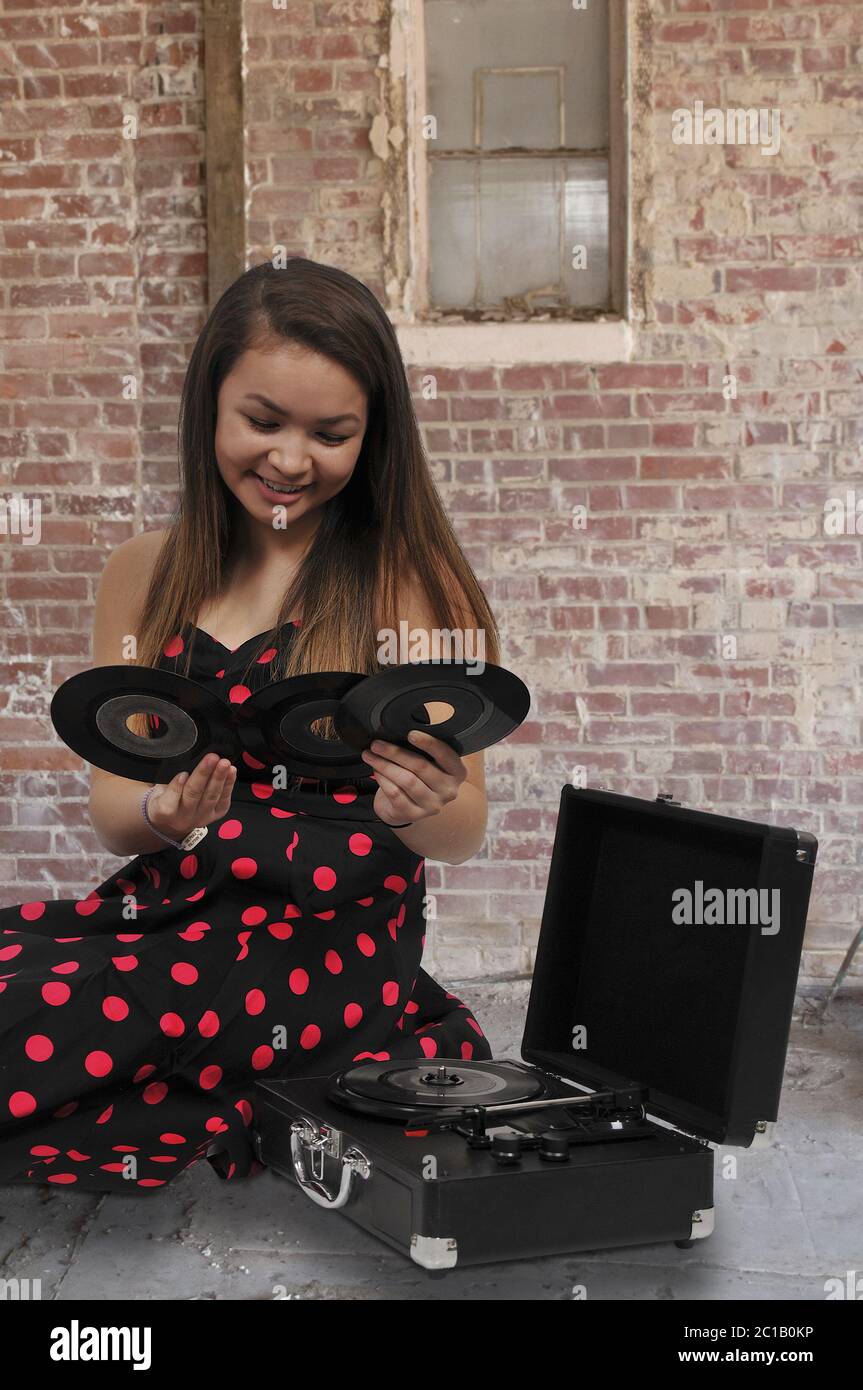 Female record record player hi-res stock photography and images - Alamy