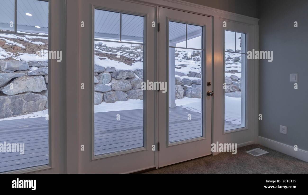 Panorama Looking out through glass windows at snow Stock Photo - Alamy