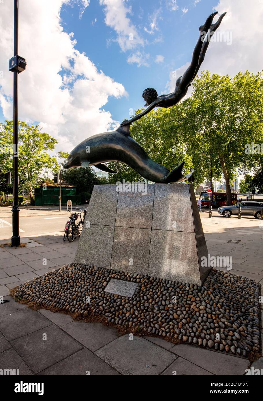 Dolphin and boy statue hi-res stock photography and images - Alamy