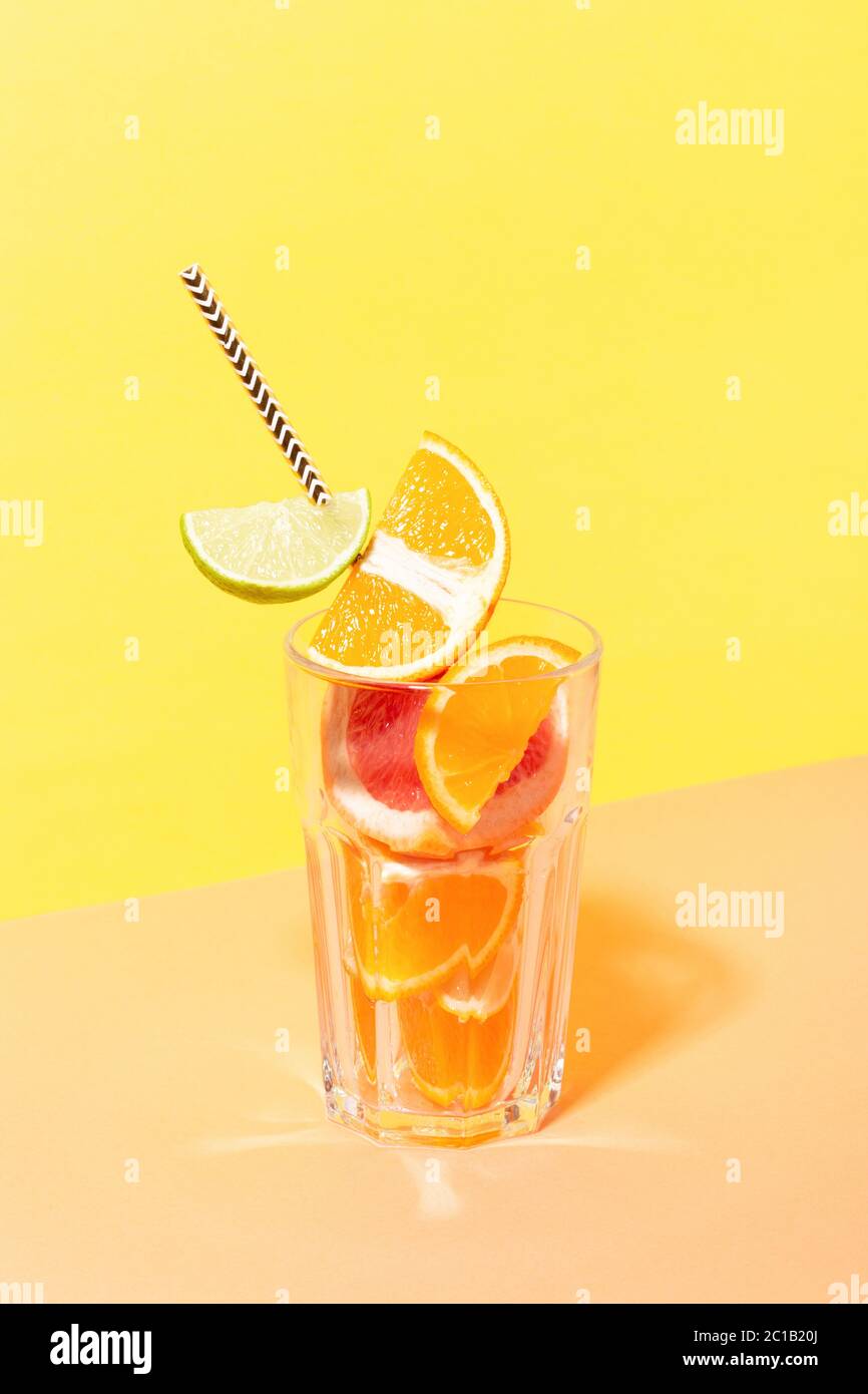 Citrus fruits in glass with straw. Summer cocktail concept Stock Photo ...