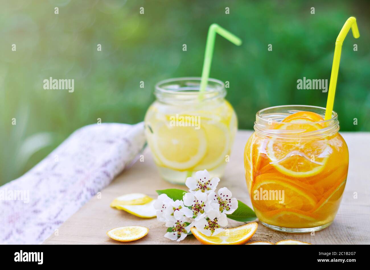 Homemade lemonade in cans in the open air. Selective focus Stock Photo ...