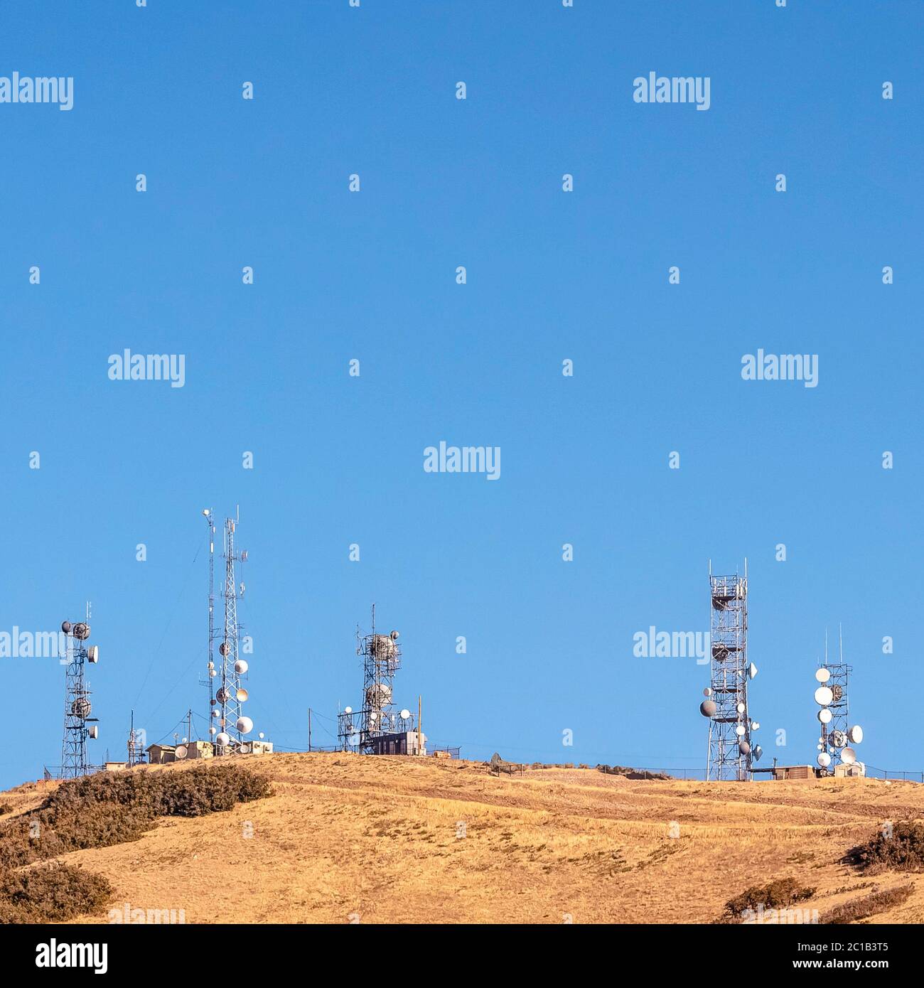 Square frame Communication towers on a mountain top day light Stock ...
