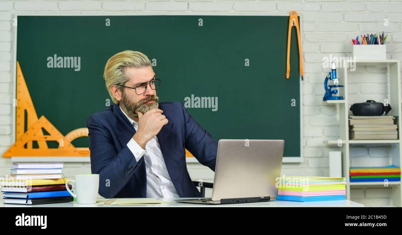 Lost in thoughts. Serious man back to school. Senior teacher look ...