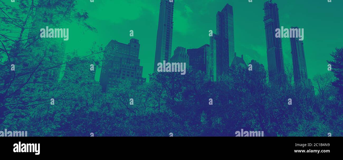 New York City skyline with the buildings of Manhattan framed by trees ...