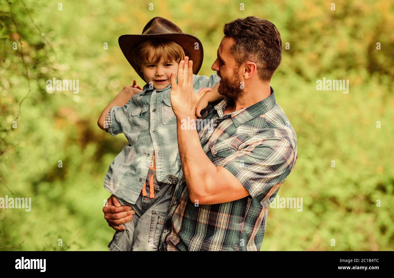 Strong like father. Power being father. Child having fun cowboy dad ...