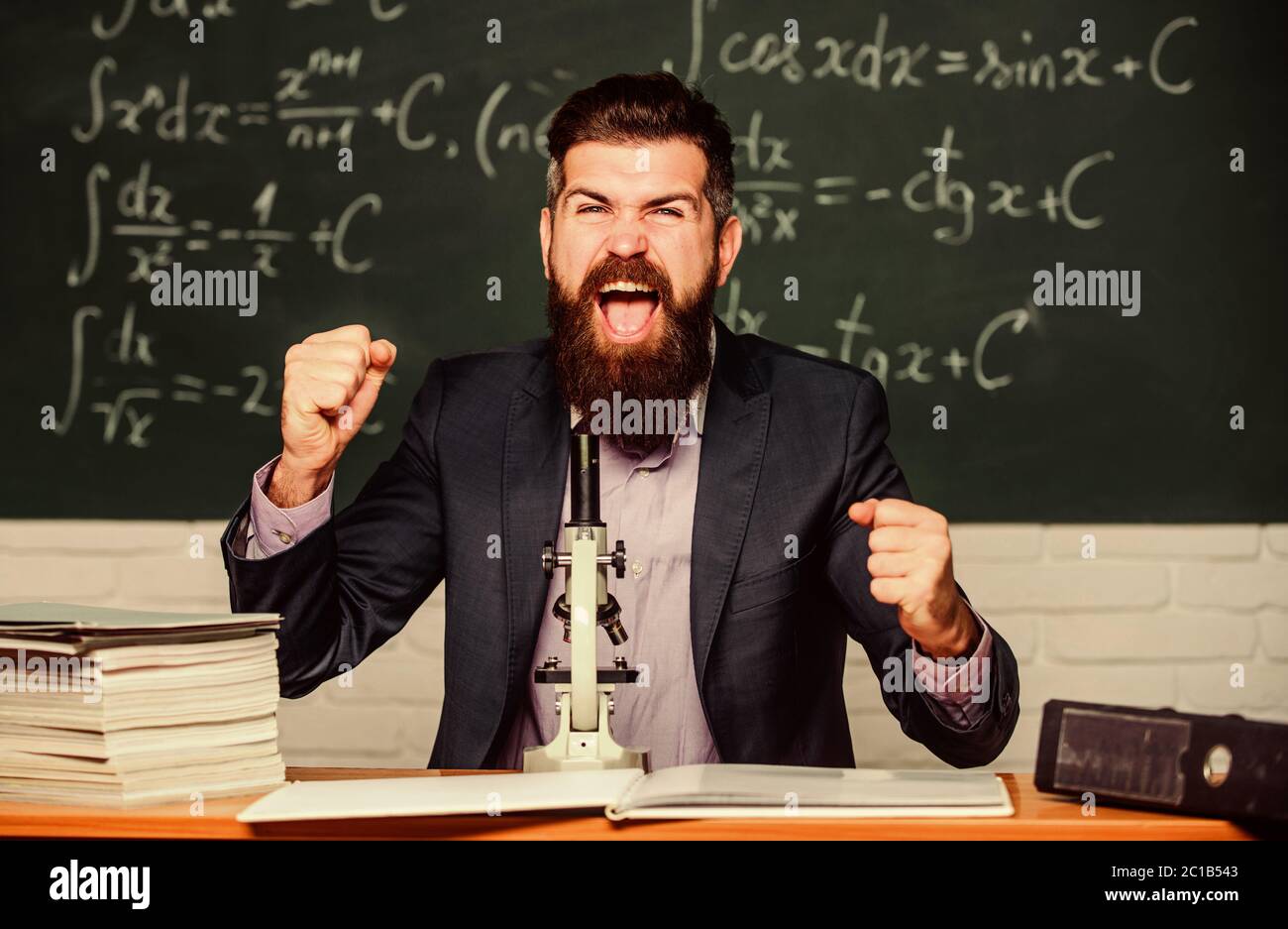 Revolutionary invention done. Happy scientist made invention. Bearded ...