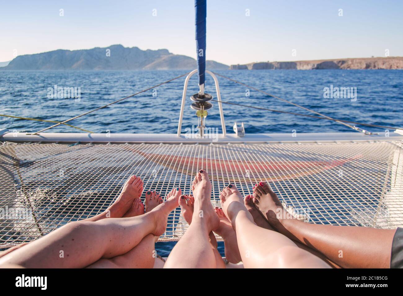 Women's feet on boat Stock Photo - Alamy