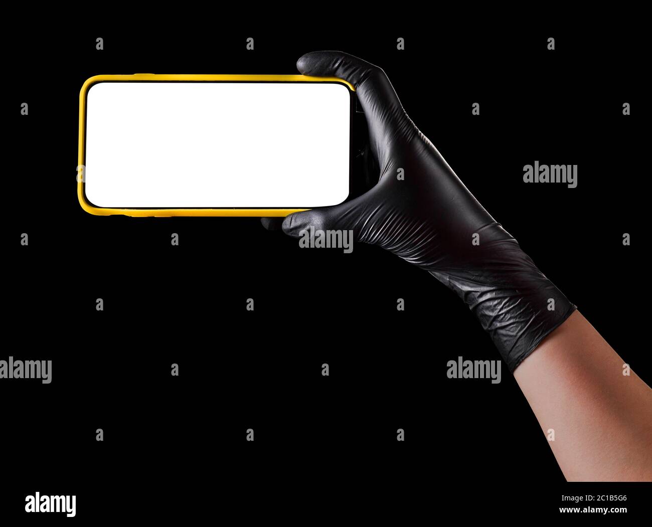 Hand in black glove holding mobile phone with blank screen isolated on ...