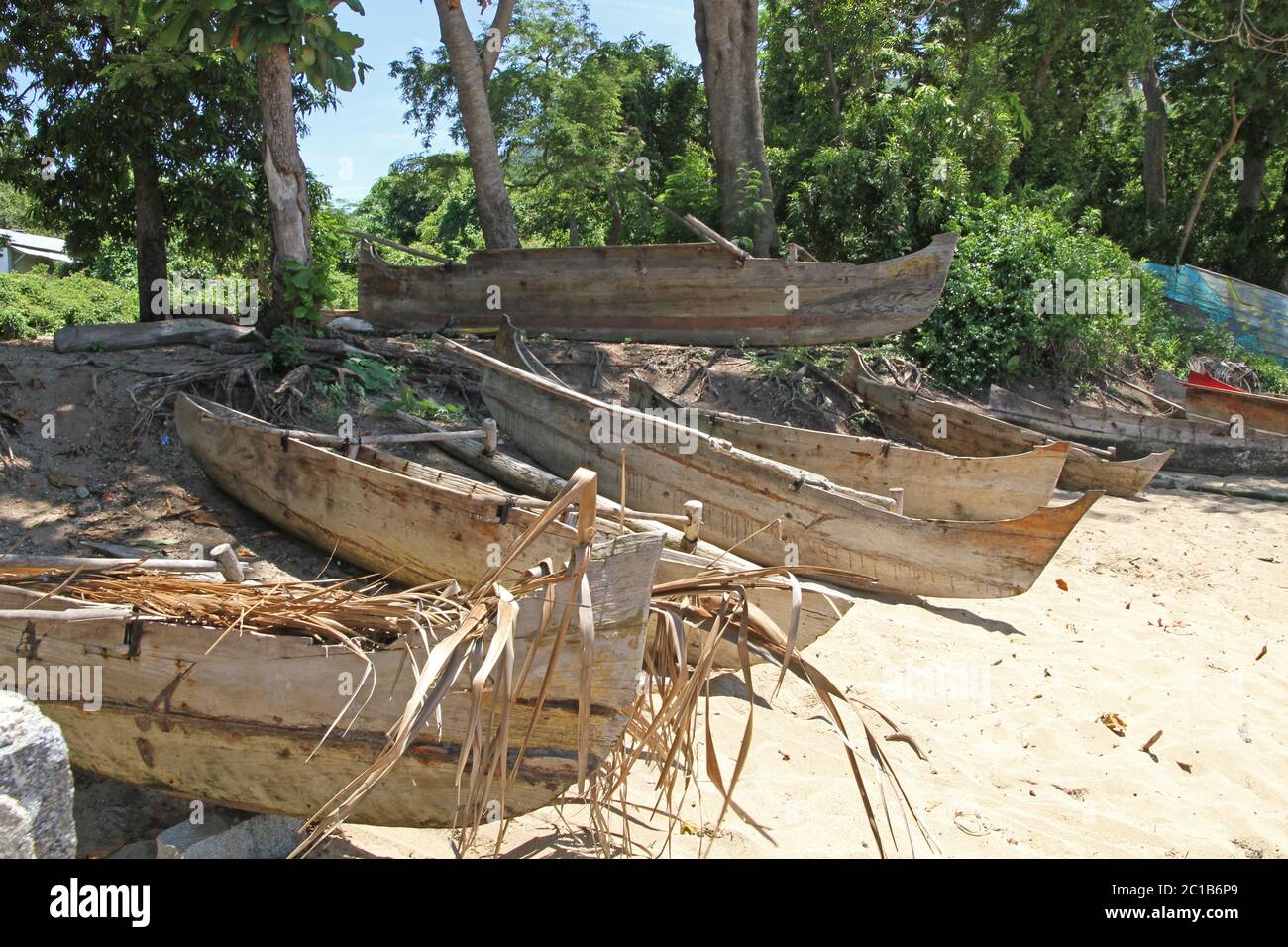 Wooden boats on beach, Ampangorinana Village, Nosy Komba Island ...