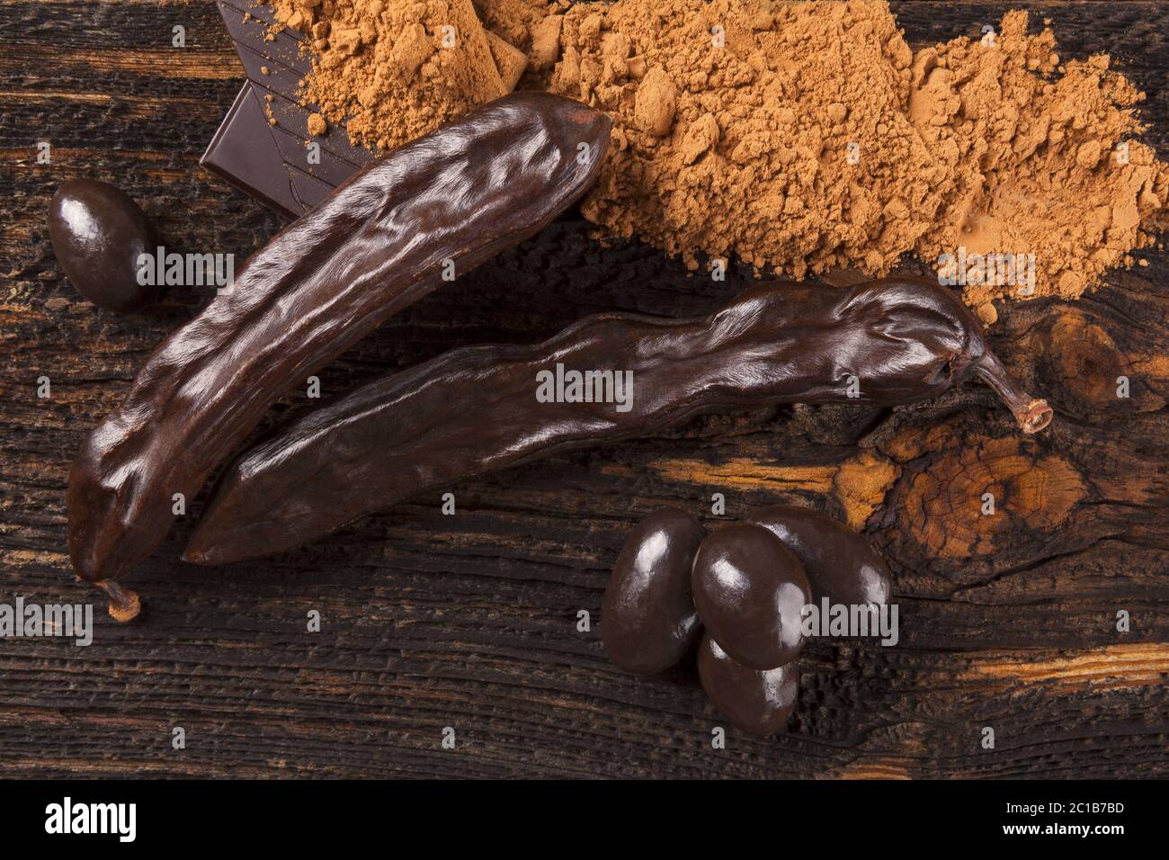 Carob fruit and carob sweets Stock Photo - Alamy