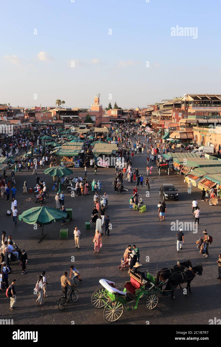 Morocco, Marrakesh. Dusk at Djemaa el Fna Square. At night the square ...