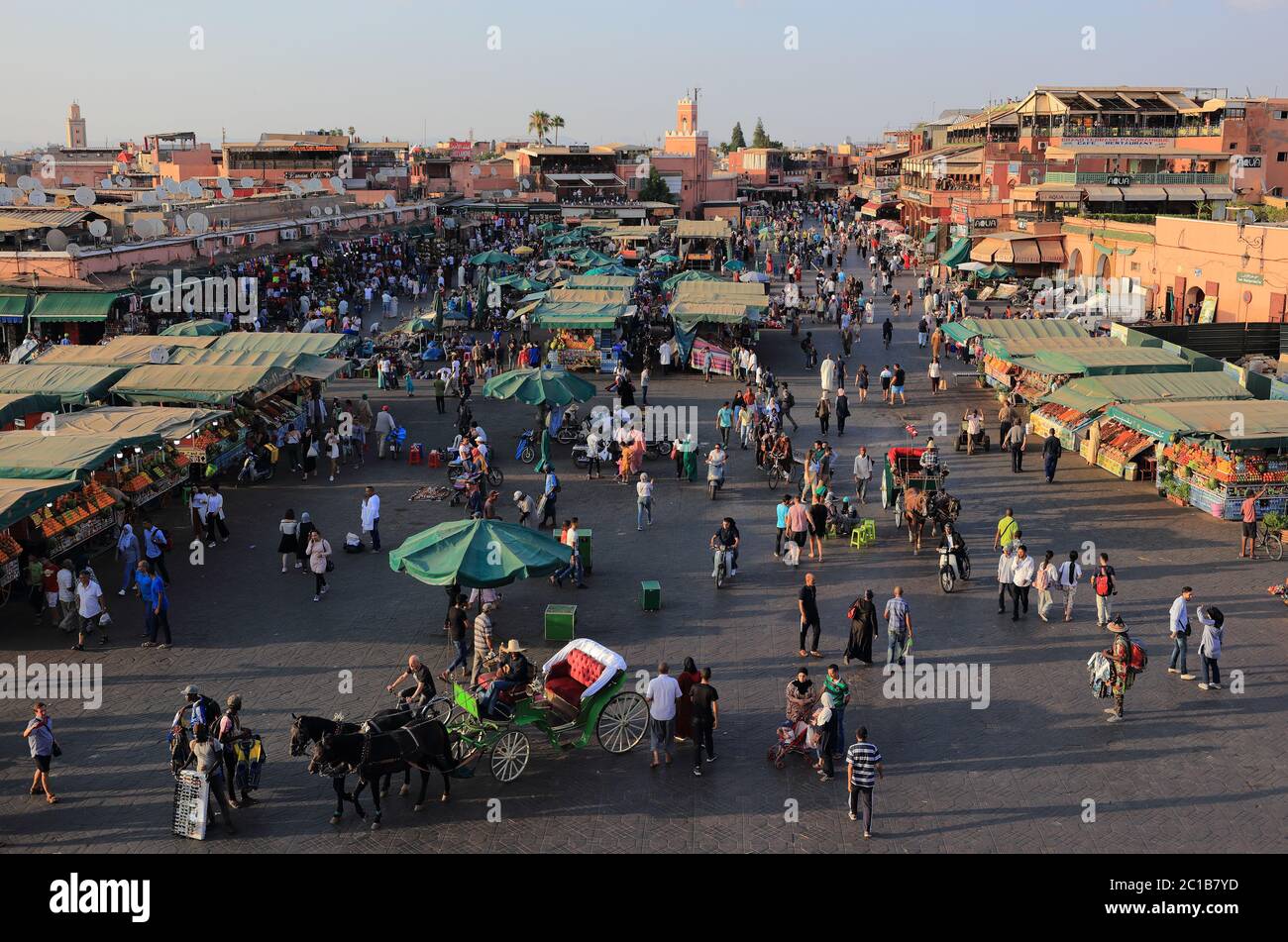 Morocco, Marrakesh. Dusk at Djemaa el Fna Square. At night the square ...