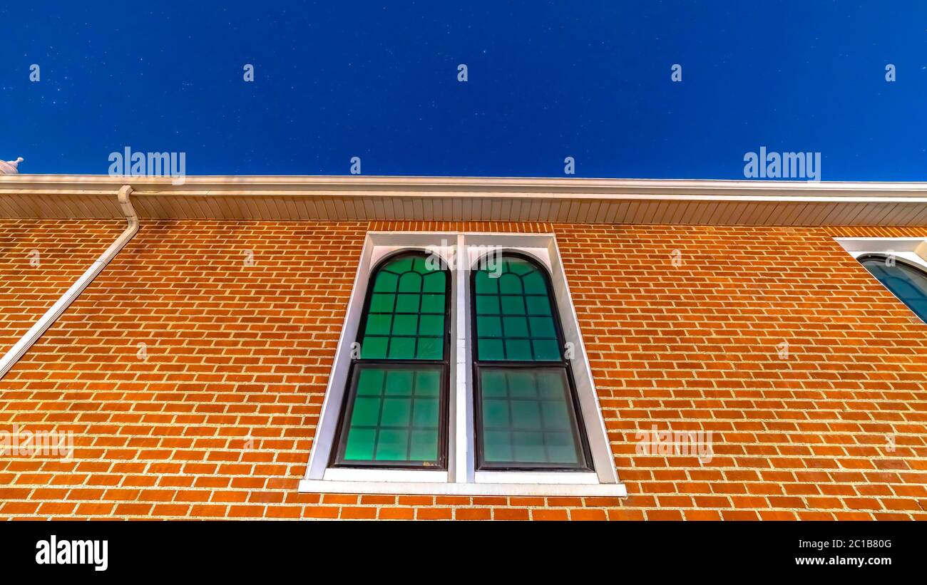 Panorama Sliding arched glas windows of a church in provo Utah against ...