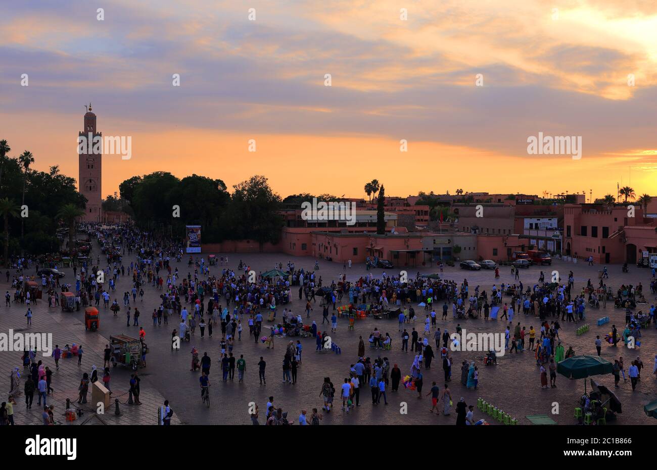 Morocco, Marrakesh. Dusk at Djemaa el Fna Square. At night the square ...
