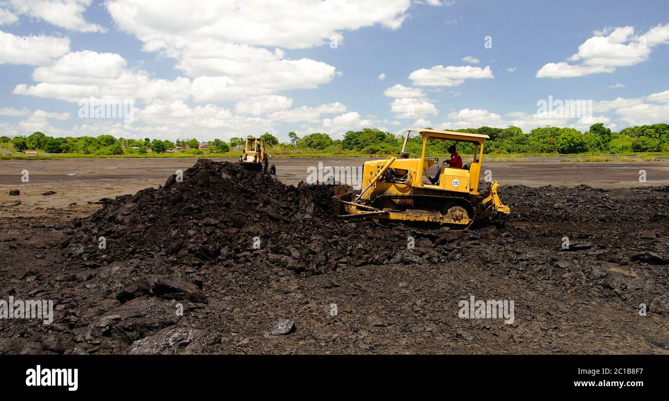 Asphalt mining in the Pitch Lake at La Brea, Trinidad and Tobago Stock ...