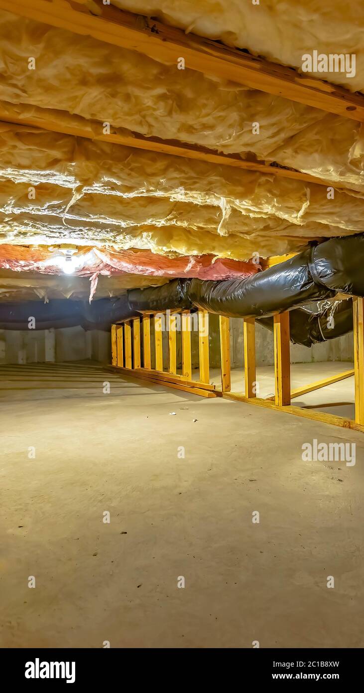 Vertical crop Basement or crawl space with upper floor insulation and ...