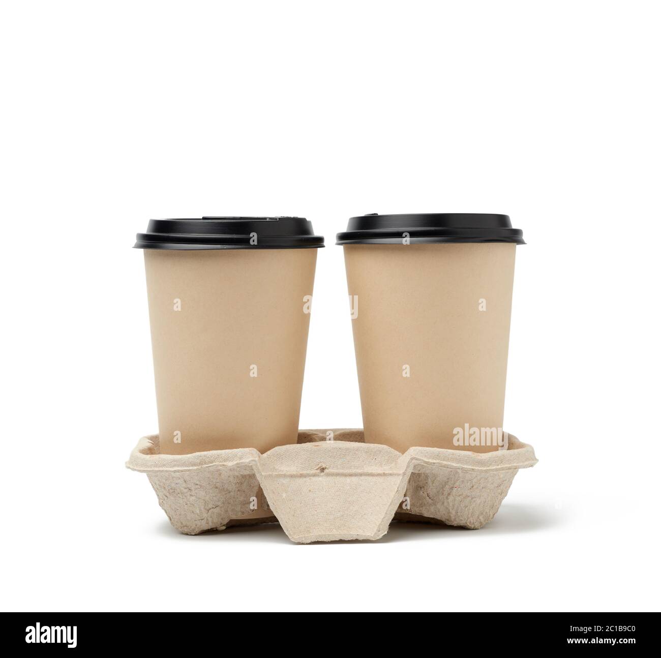two brown paper disposable cups with a plastic lid stand in the tray ...