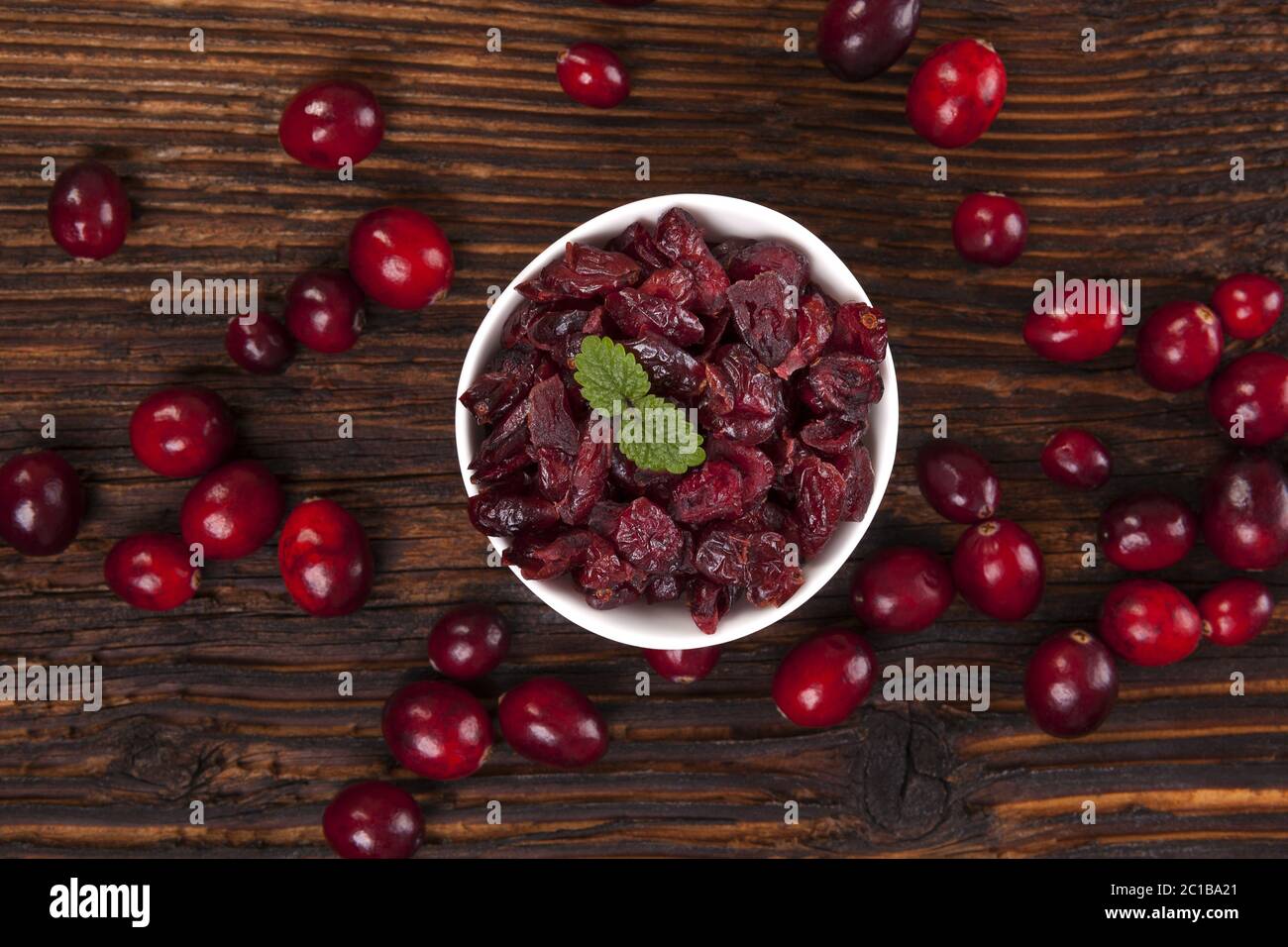 Bowl fresh organic cranberries dried hi-res stock photography and ...
