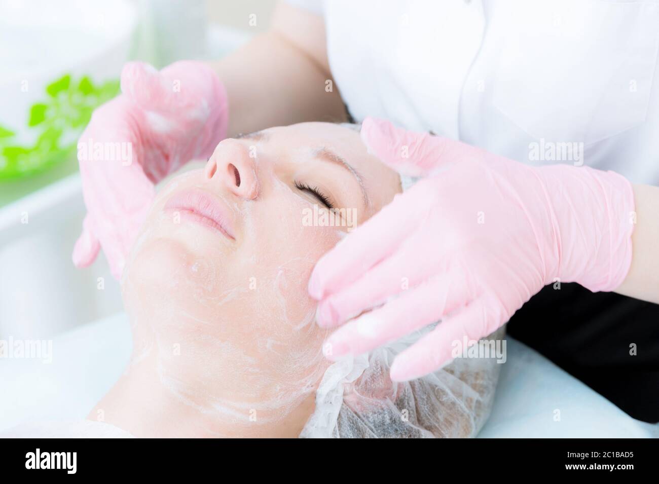 A close-up of the cleaning procedure in the office of cosmetology ...
