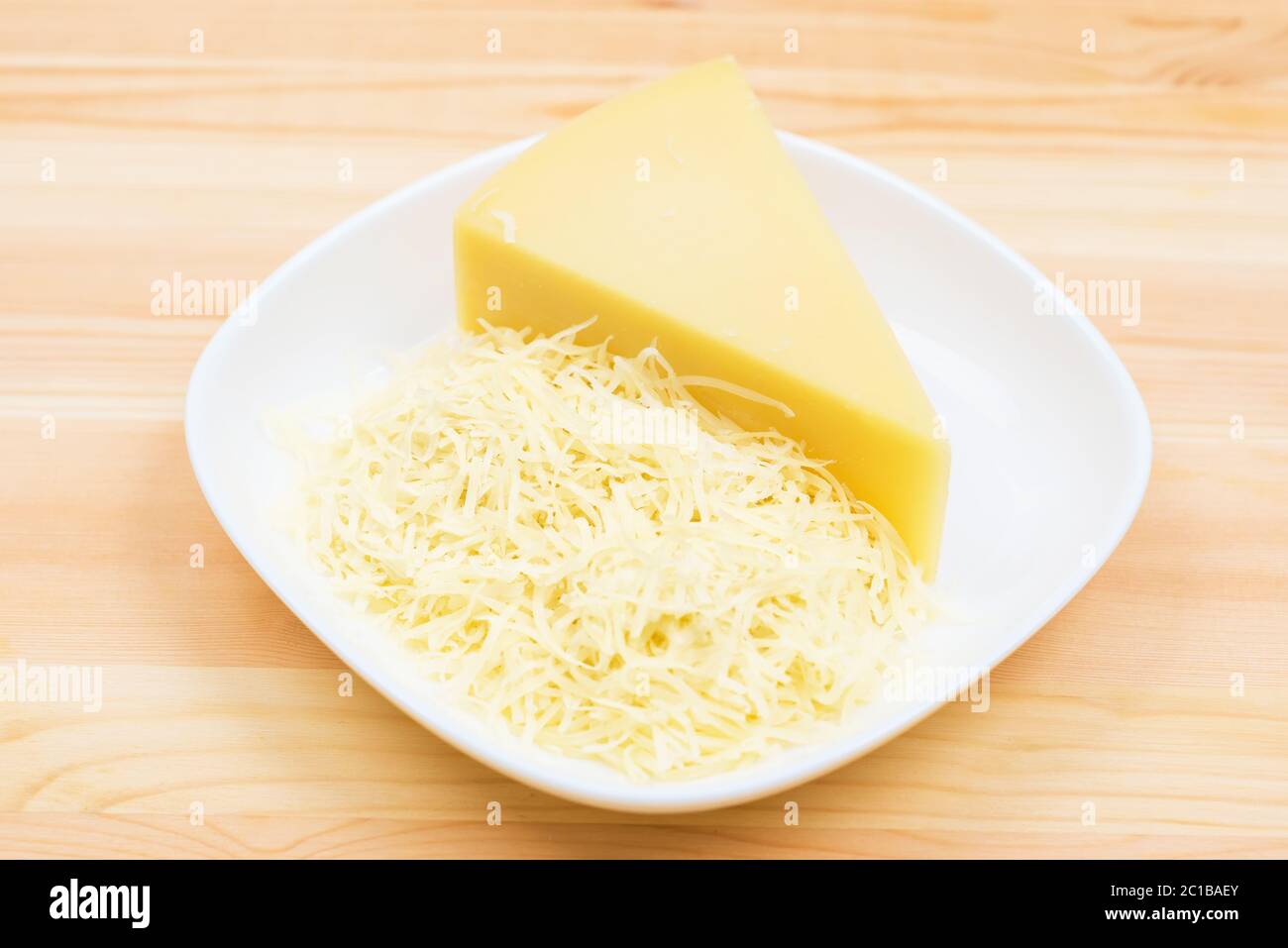 Pile grated cheddar cheese cheddar cheese block hi-res stock ...
