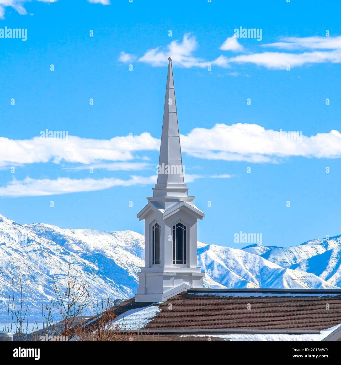 Square frame Rooftop of church with a modern spire design against snowy ...
