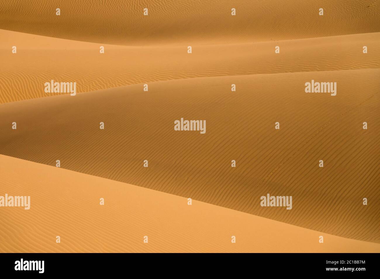 Background with of sandy dunes in desert Stock Photo - Alamy