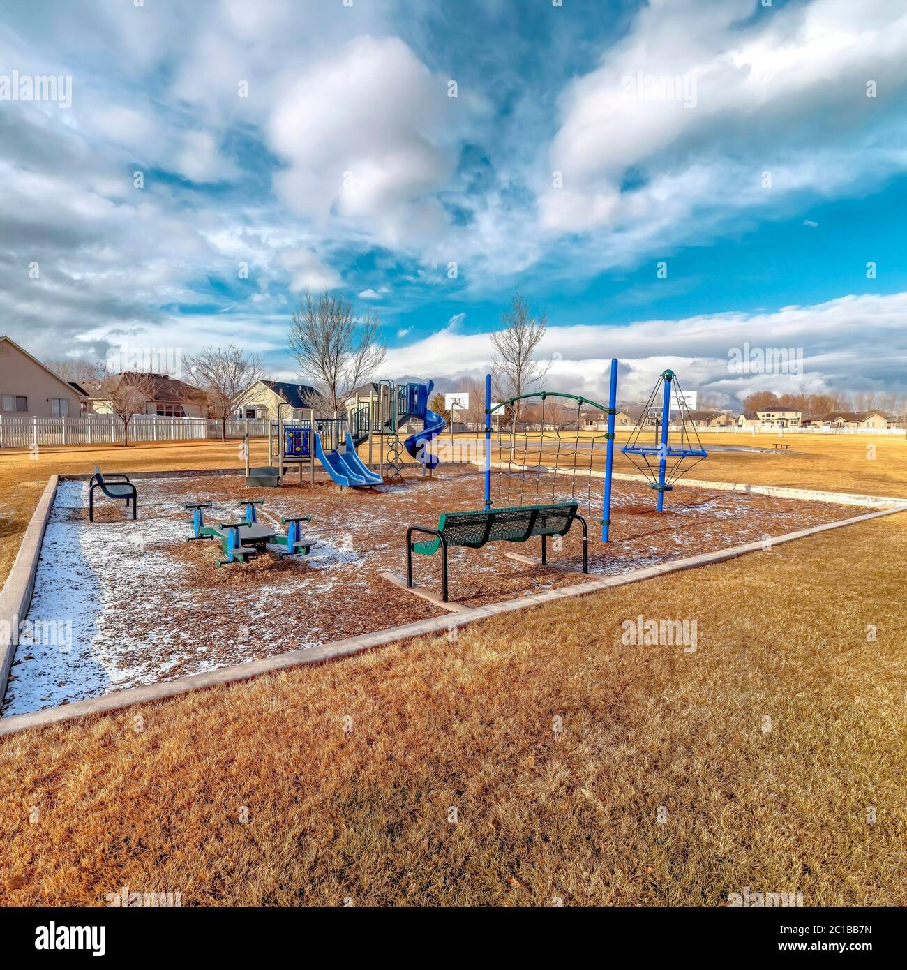 Square frame Childrens playground with neighborhood homes background ...