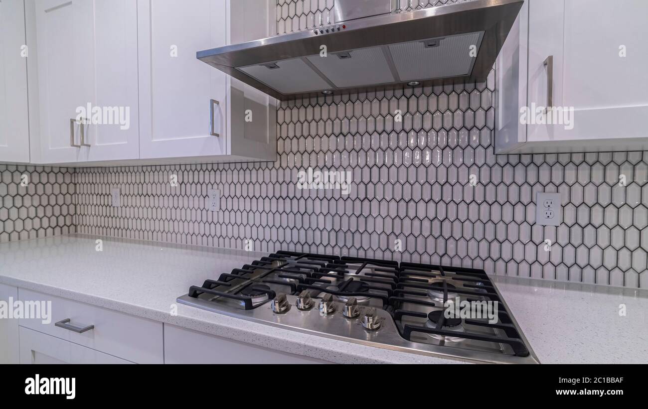 Panorama frame Modern cooker hob and extractor fan interior Stock Photo ...