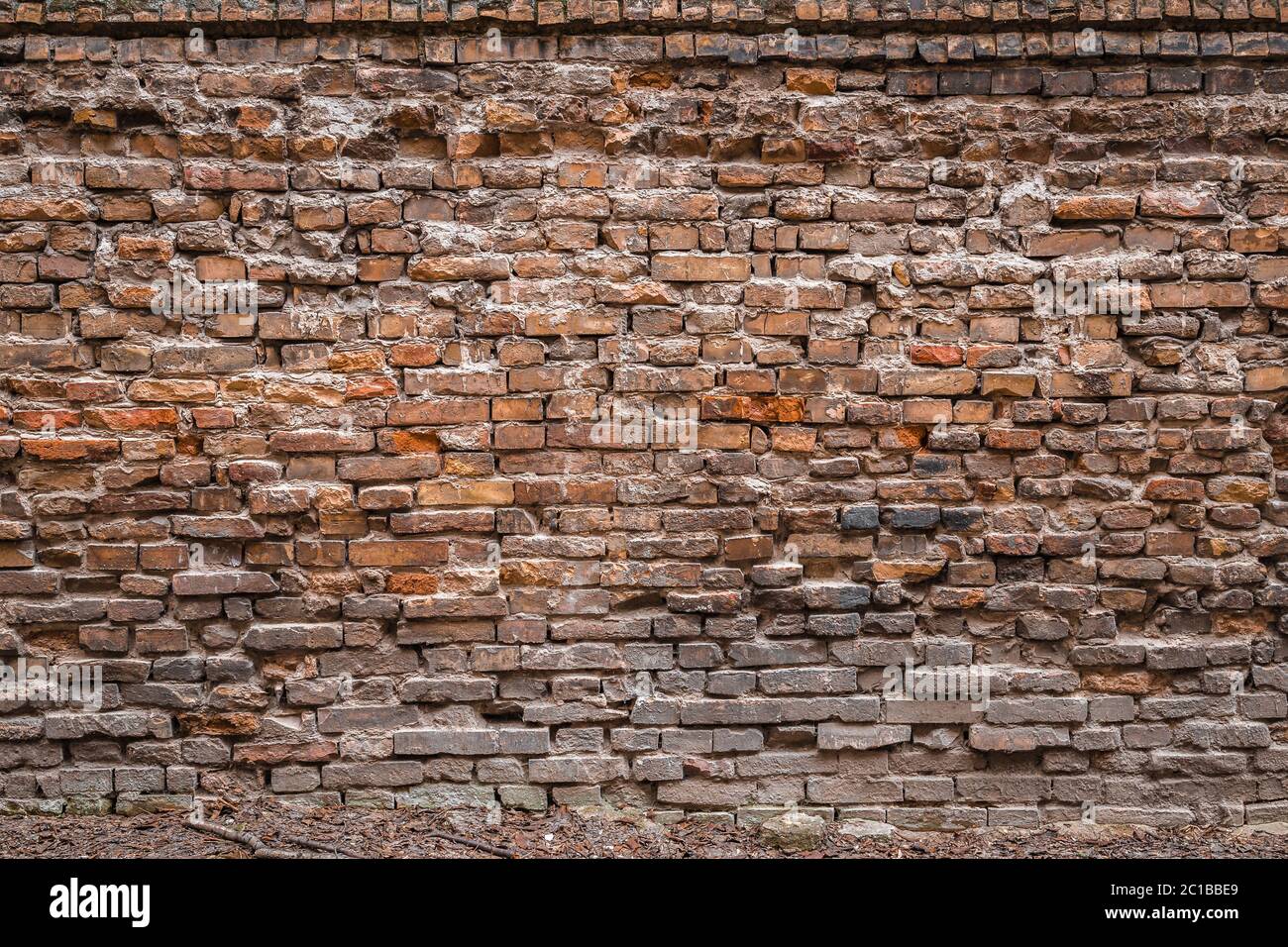 Old messy brick wall texture background exterior Stock Photo - Alamy