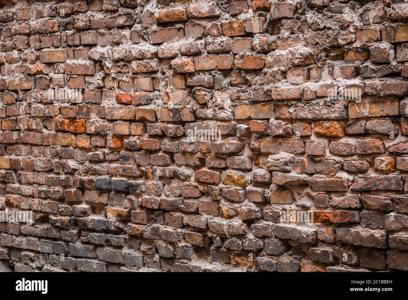 Old messy brick wall texture background exterior Stock Photo - Alamy