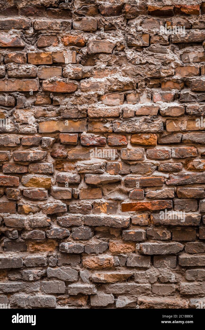 Old messy brick wall texture background exterior Stock Photo - Alamy